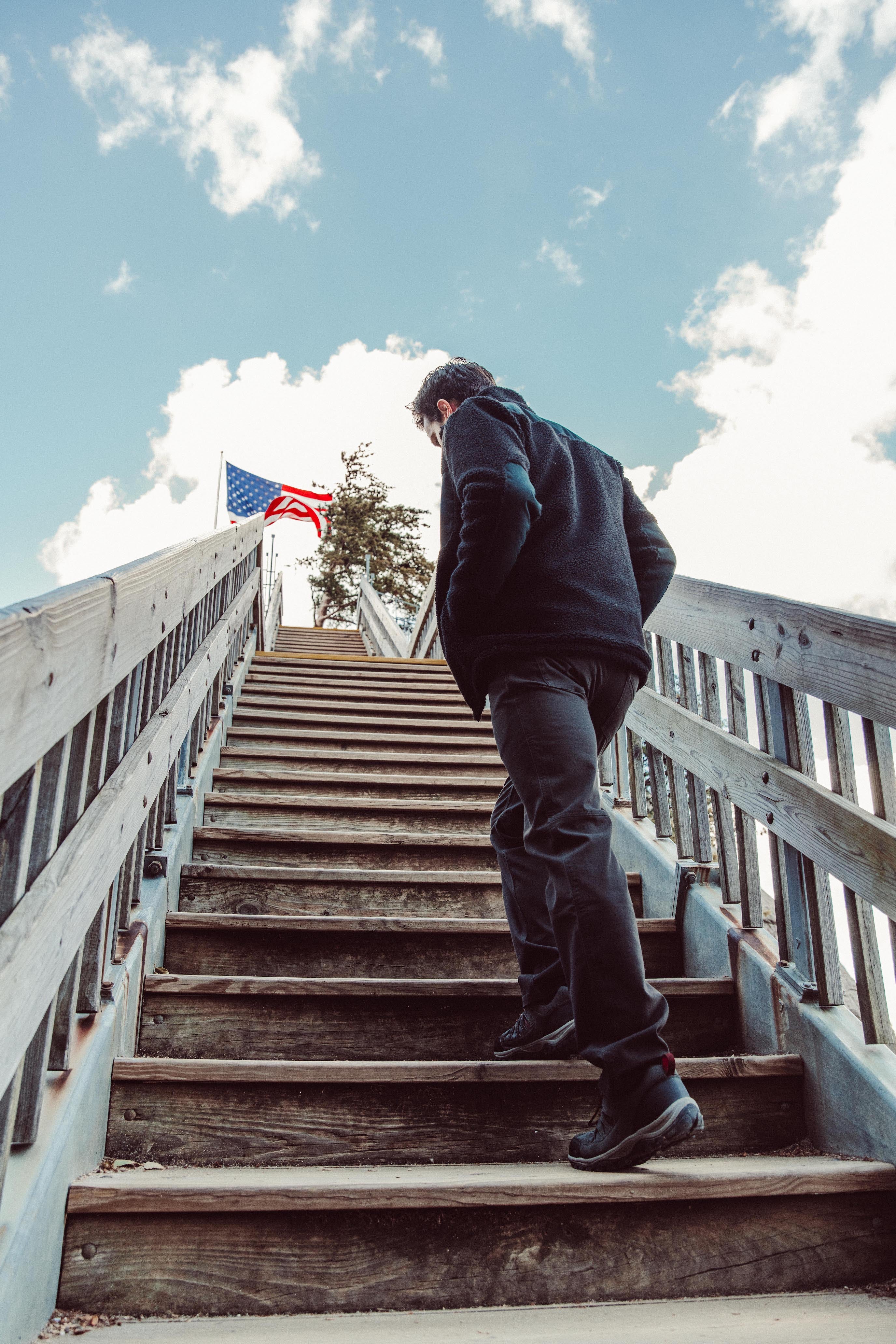 Man wearing Forge Jacket walking up the stairs