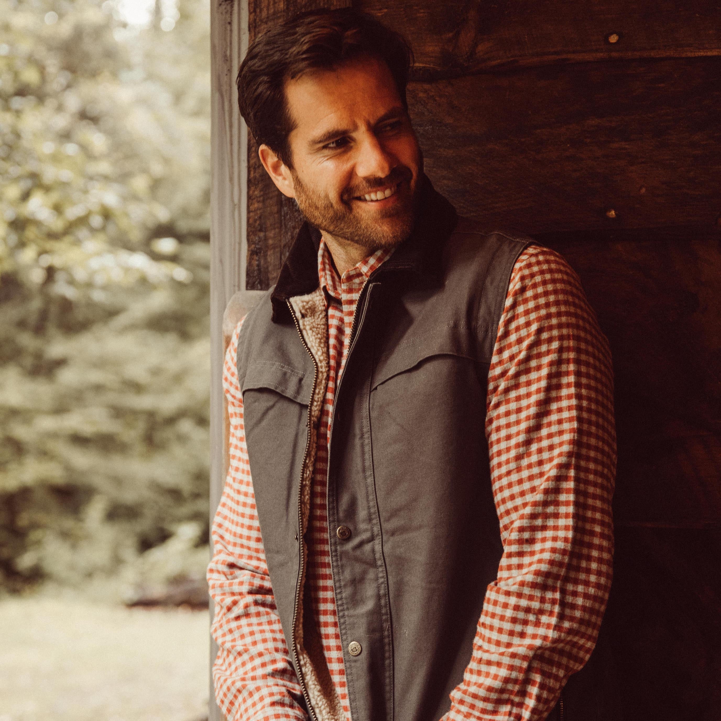 A man wears Sullivan Ranch Vest standing outdoor
